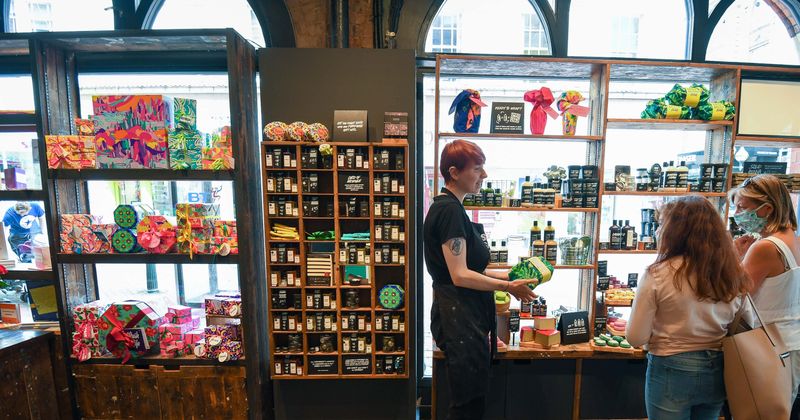 Cover Image Source: People wearing protective face masks shop in Lush ...